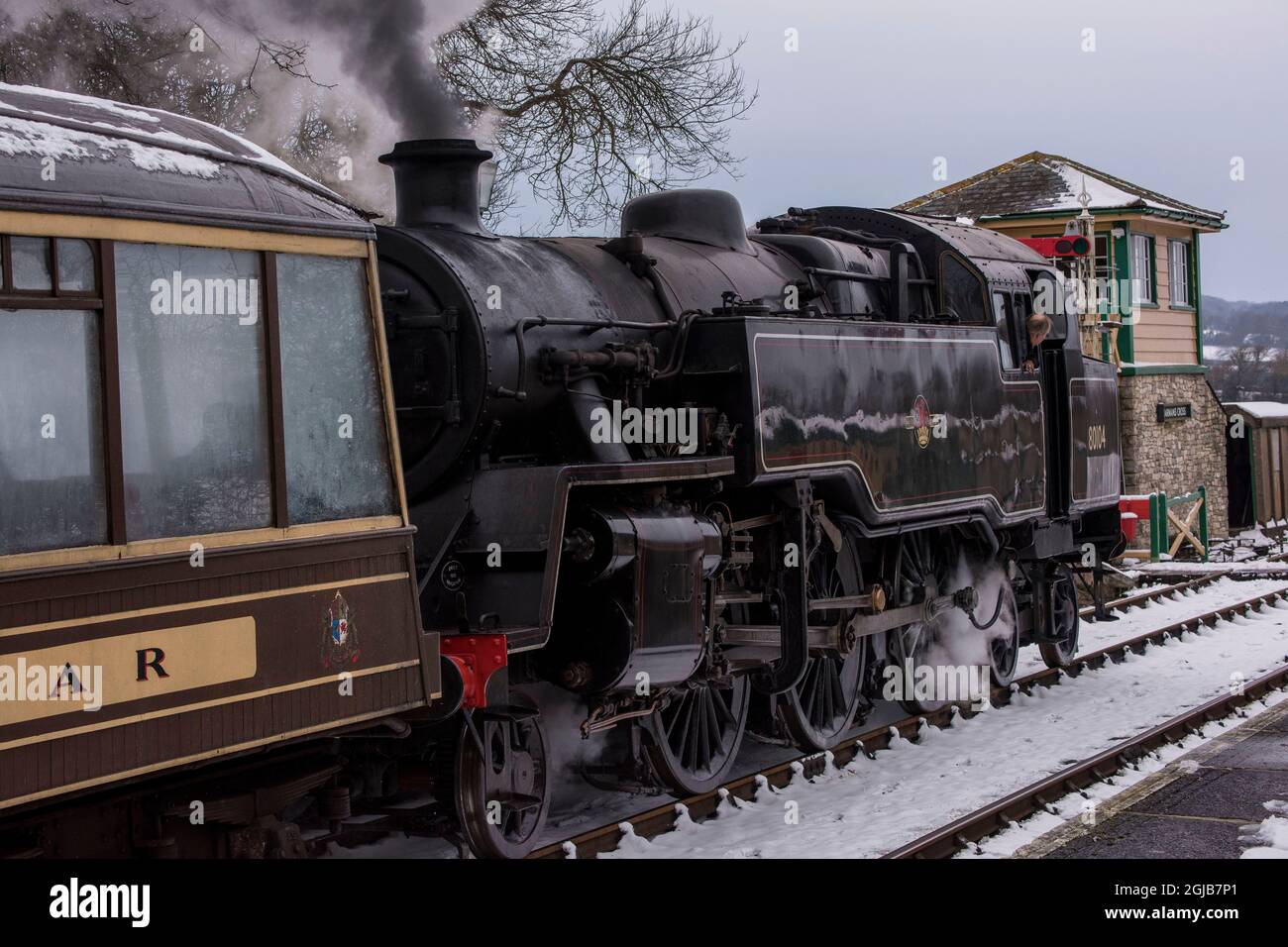 Steam trains in snow at swanage railway hi-res stock photography and ...