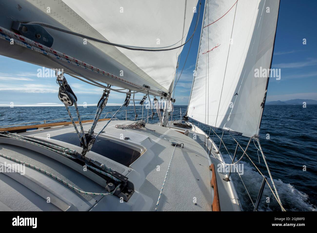 USA, Alaska, Juneau, Gulf 32 pilothouse boat under full sail in ...