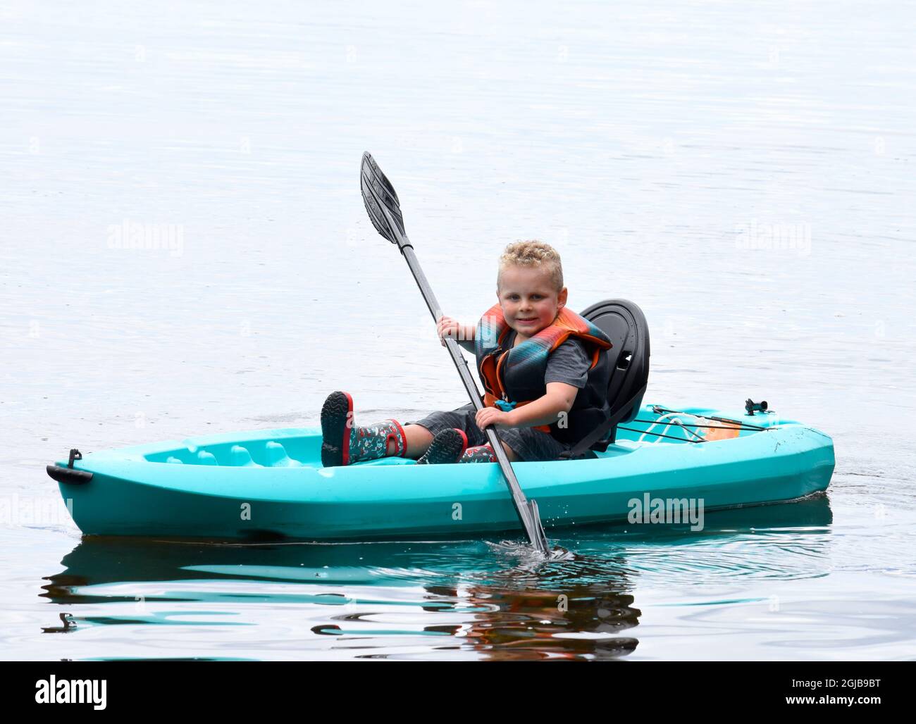 Alaska, Ketchikan, 5 year old boy kayaking in ocean. (MR Stock Photo ...
