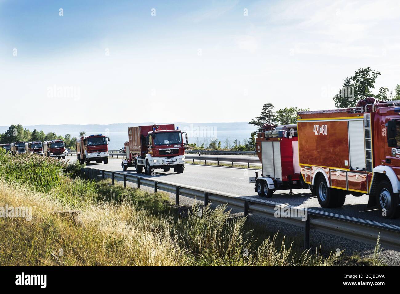 A konvoj of firefighters and theri vehicle from Poland are seen passing ...