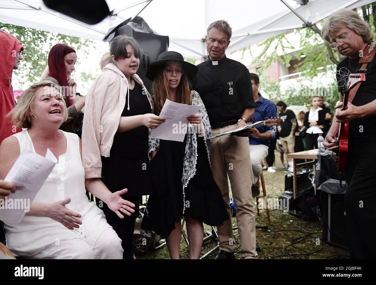 Family and friends gather during a memorial service for 20-year-old ...