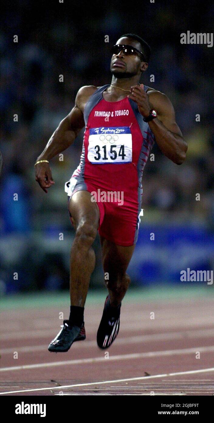 Trinidad & Tobago's Ato Boldon (c) strolls through his heat of the men ...