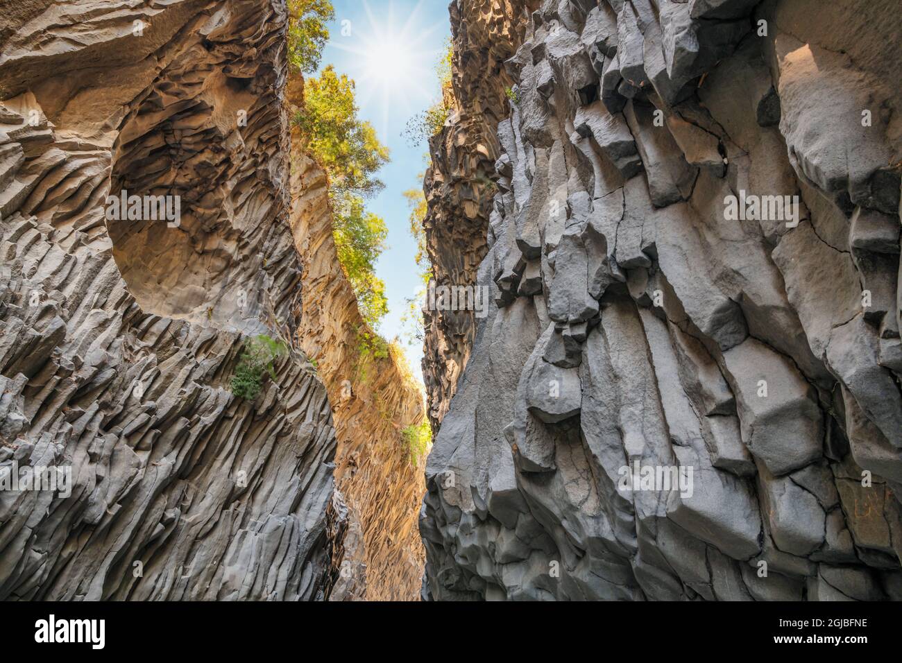Stone slopes of Alcantara Gorge formed by lava of Mount Etna, island ...