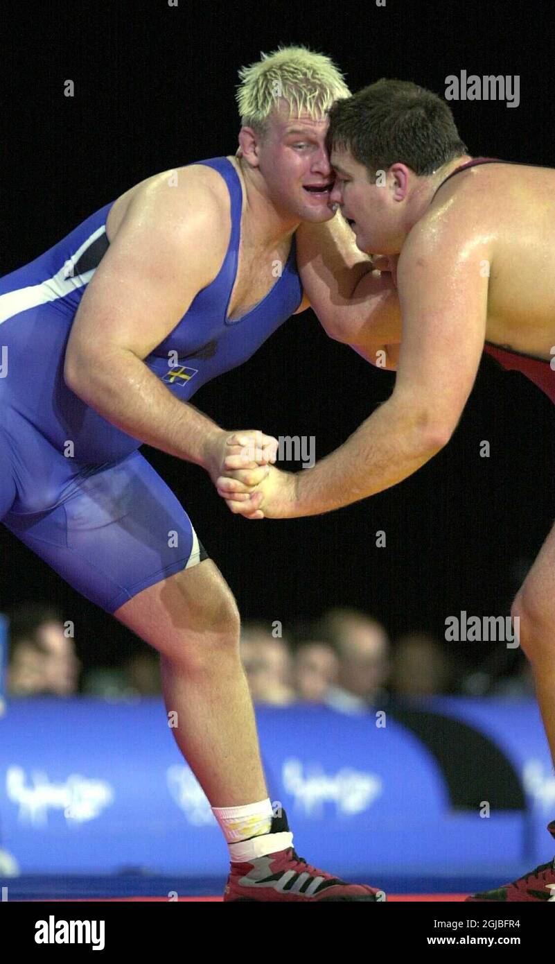 Wrestlers try to overpower each other Stock Photo - Alamy