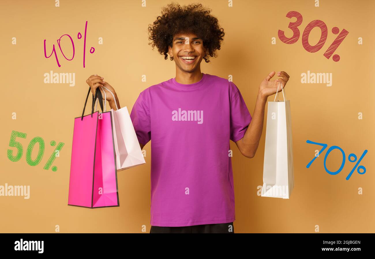 Happy man is happy to buy from shops Stock Photo - Alamy