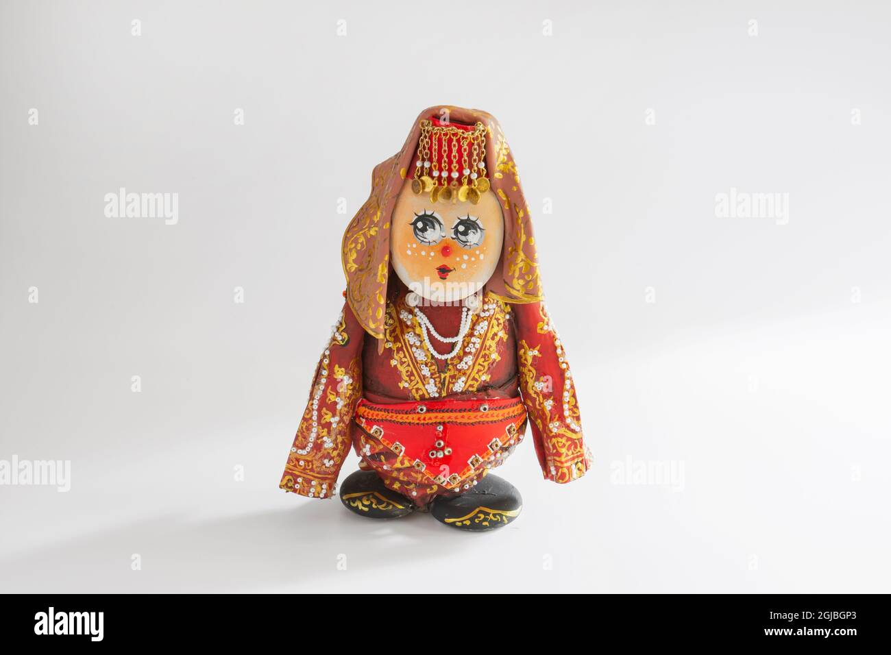 Painting on stone and handmade dress-up dolls. Figures showing local ...