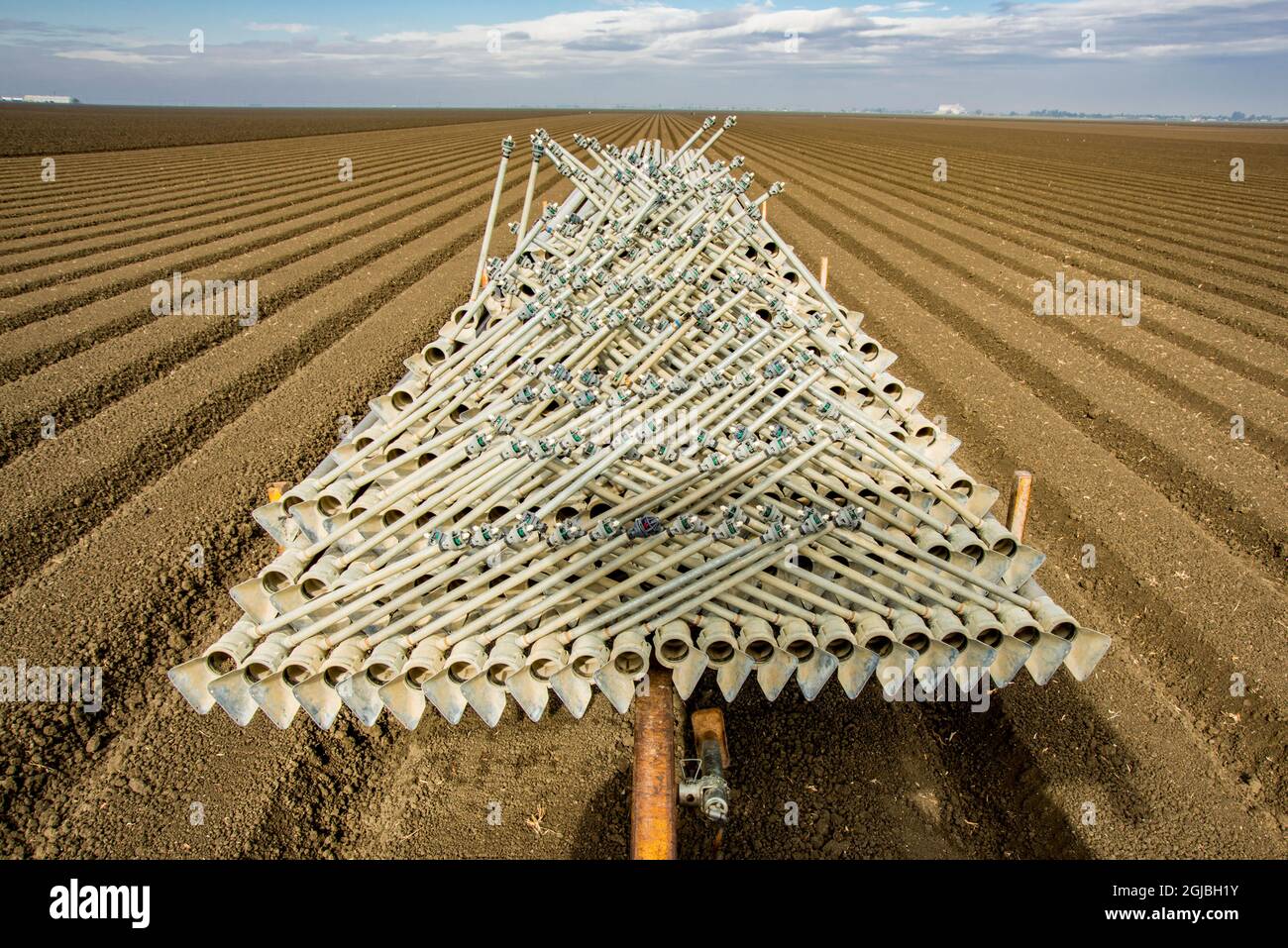 USA, California, Central Valley. Firebaugh, pipes ready to be laid for ...