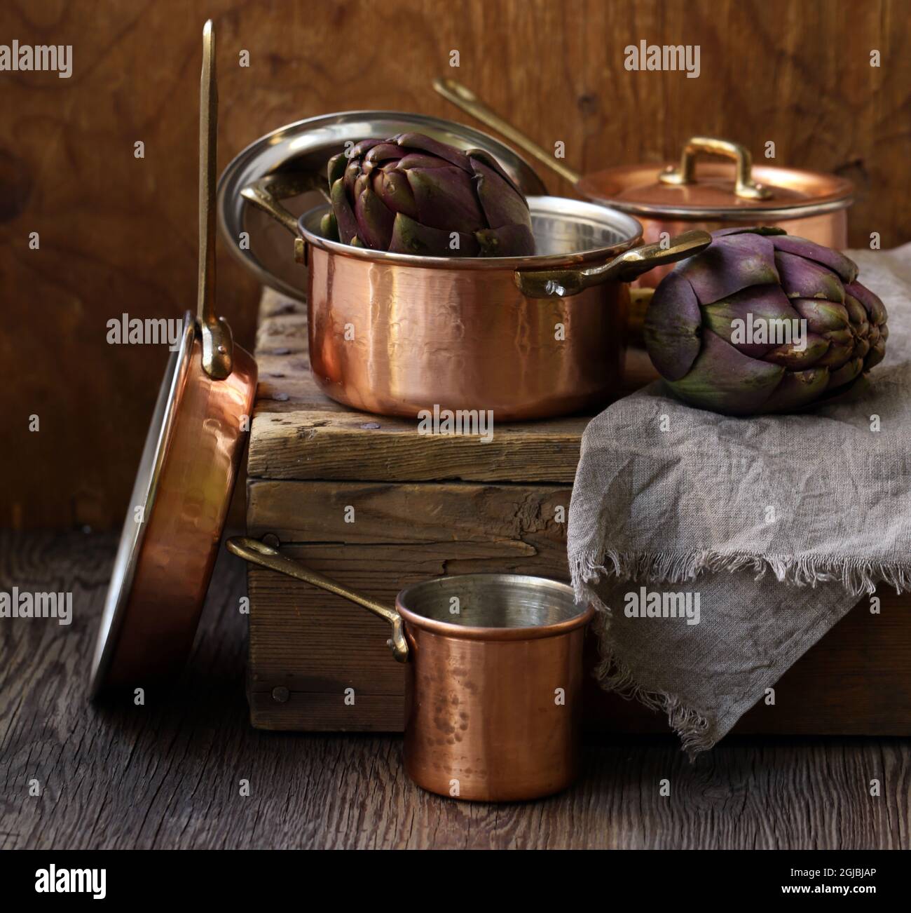 Still life copper utensils on the wooden background Stock Photo - Alamy