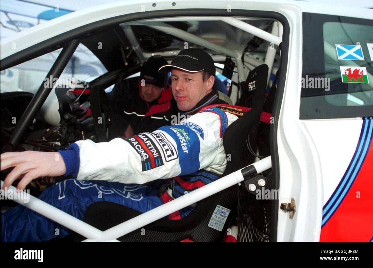 Colin McRae shuts the door of his Ford Focus Stock Photo - Alamy