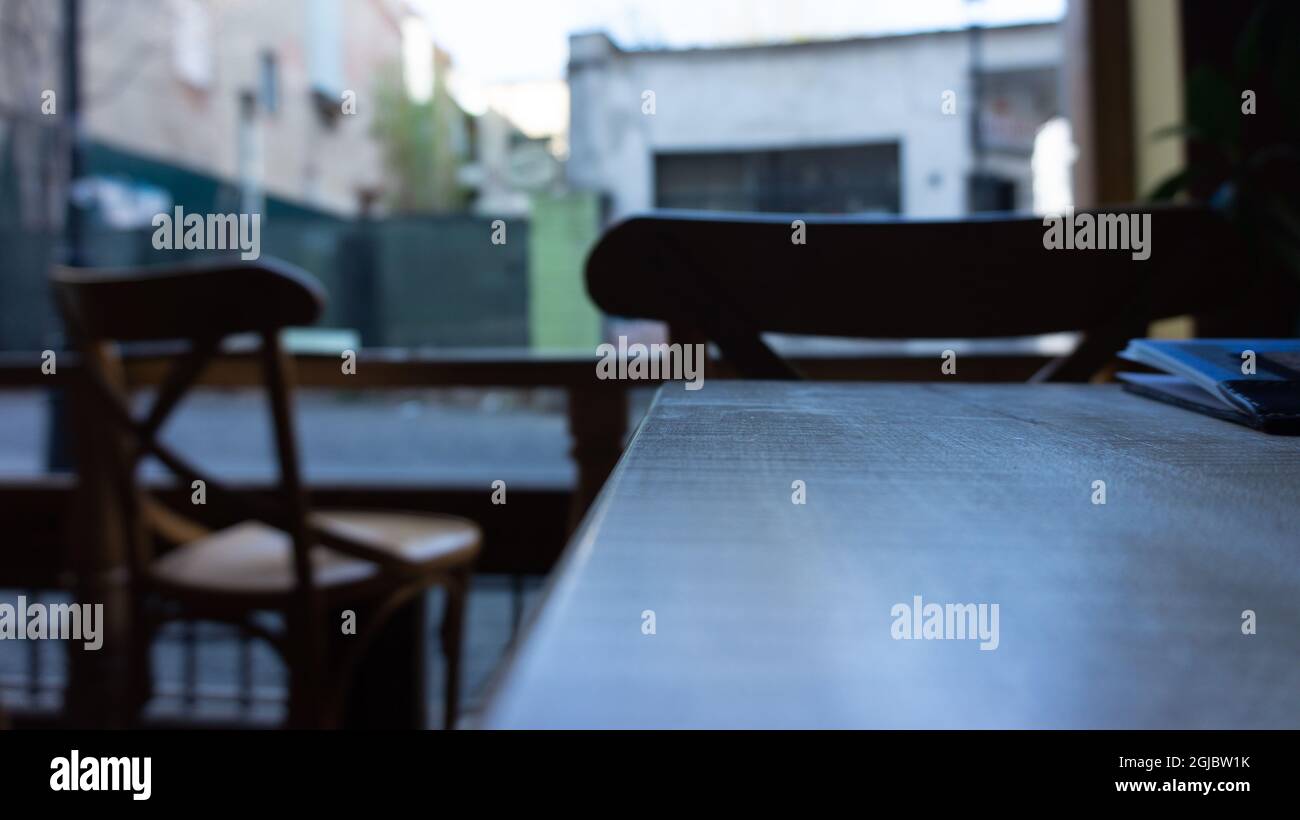 Closeup shot of a cafe interior with a window looking at the street ...