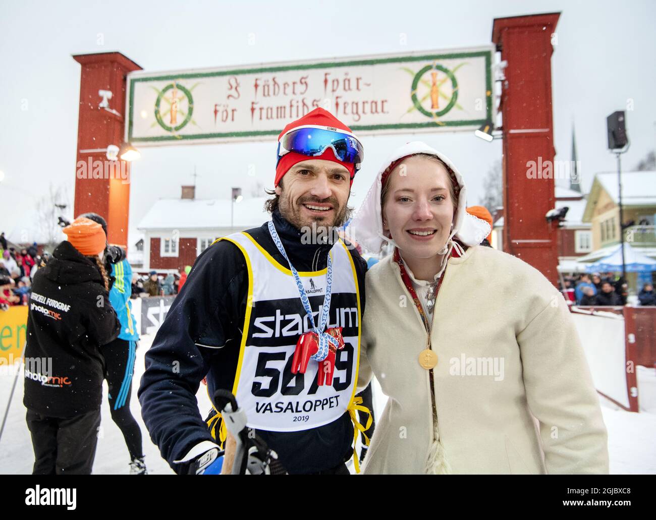 Prince Carl Philip poses with the "wreath girl" or kranskullan Emma ...