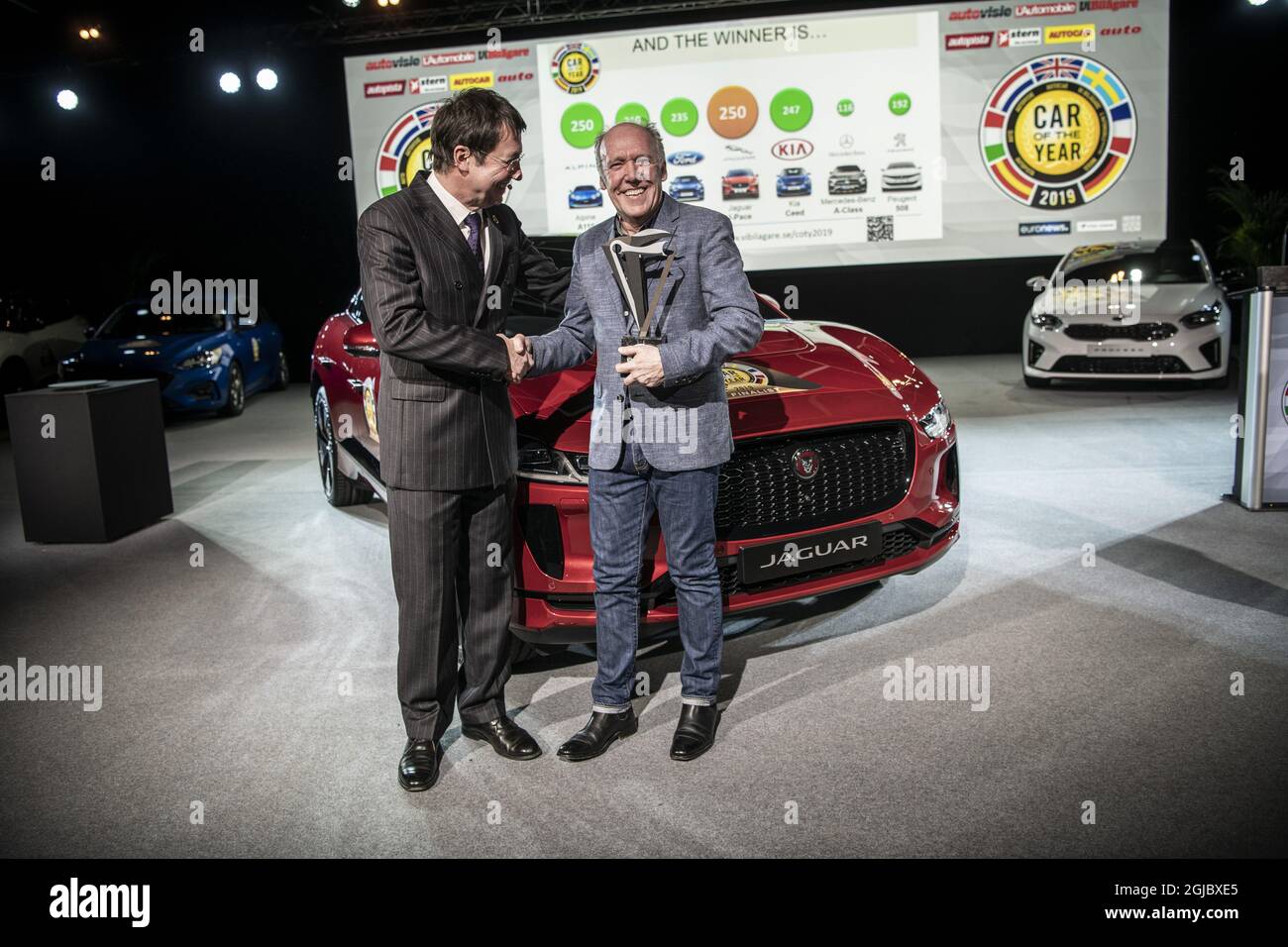 Chair of the jury congratulate Frank Janssen Jaguar head of Design Ian ...