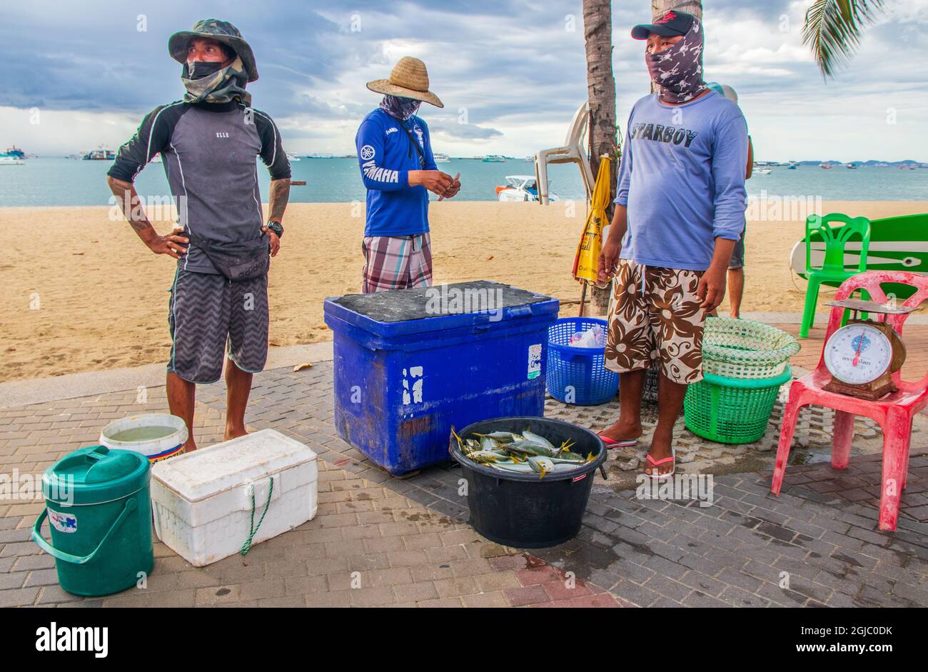 PATTAYA, THAILAND - Aug 24, 2021: Thai fishermen selling freshly caught ...