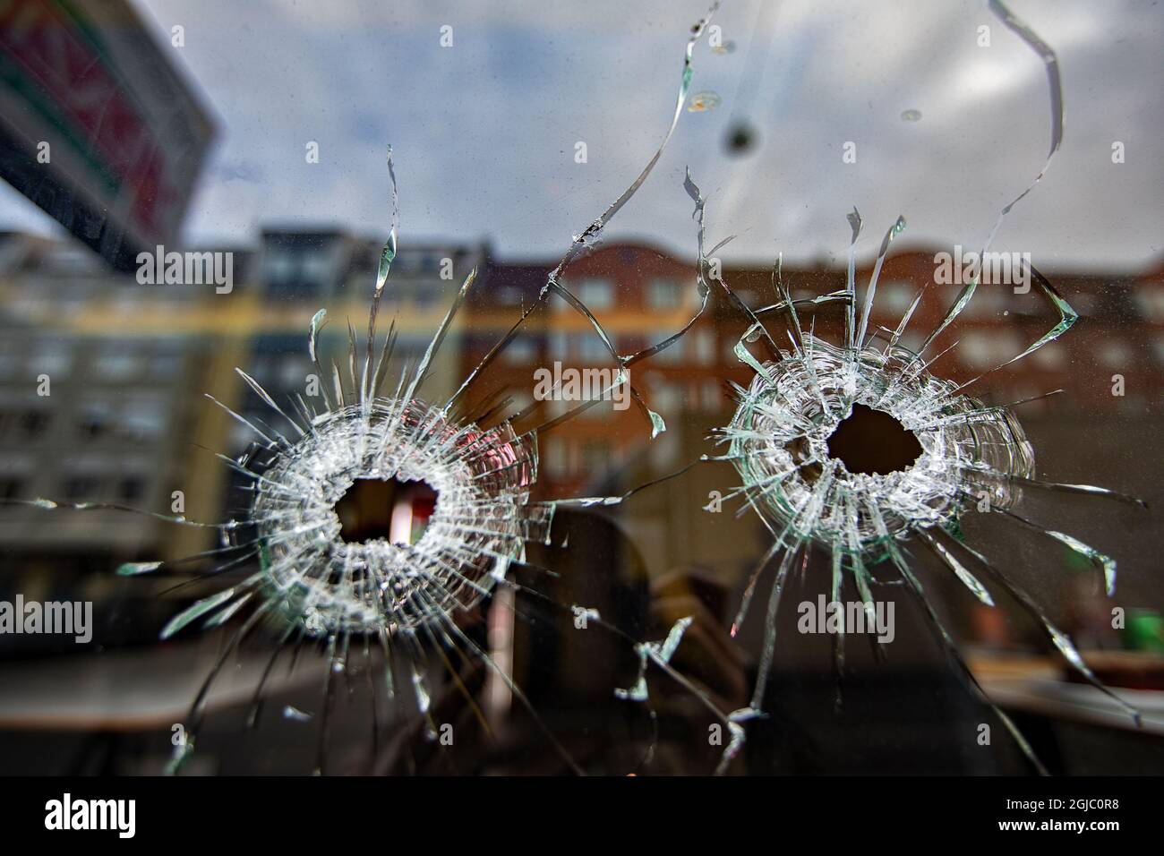 Bullet holes in window shooting arms guns violence Foto Hussein El ...