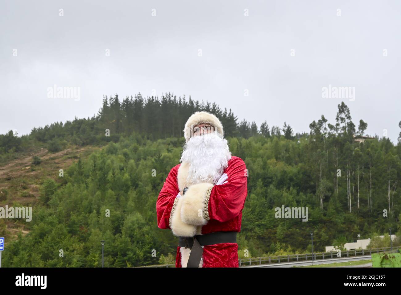 Young male in a Santa Claus suit doing a funny pose outdoors Stock ...