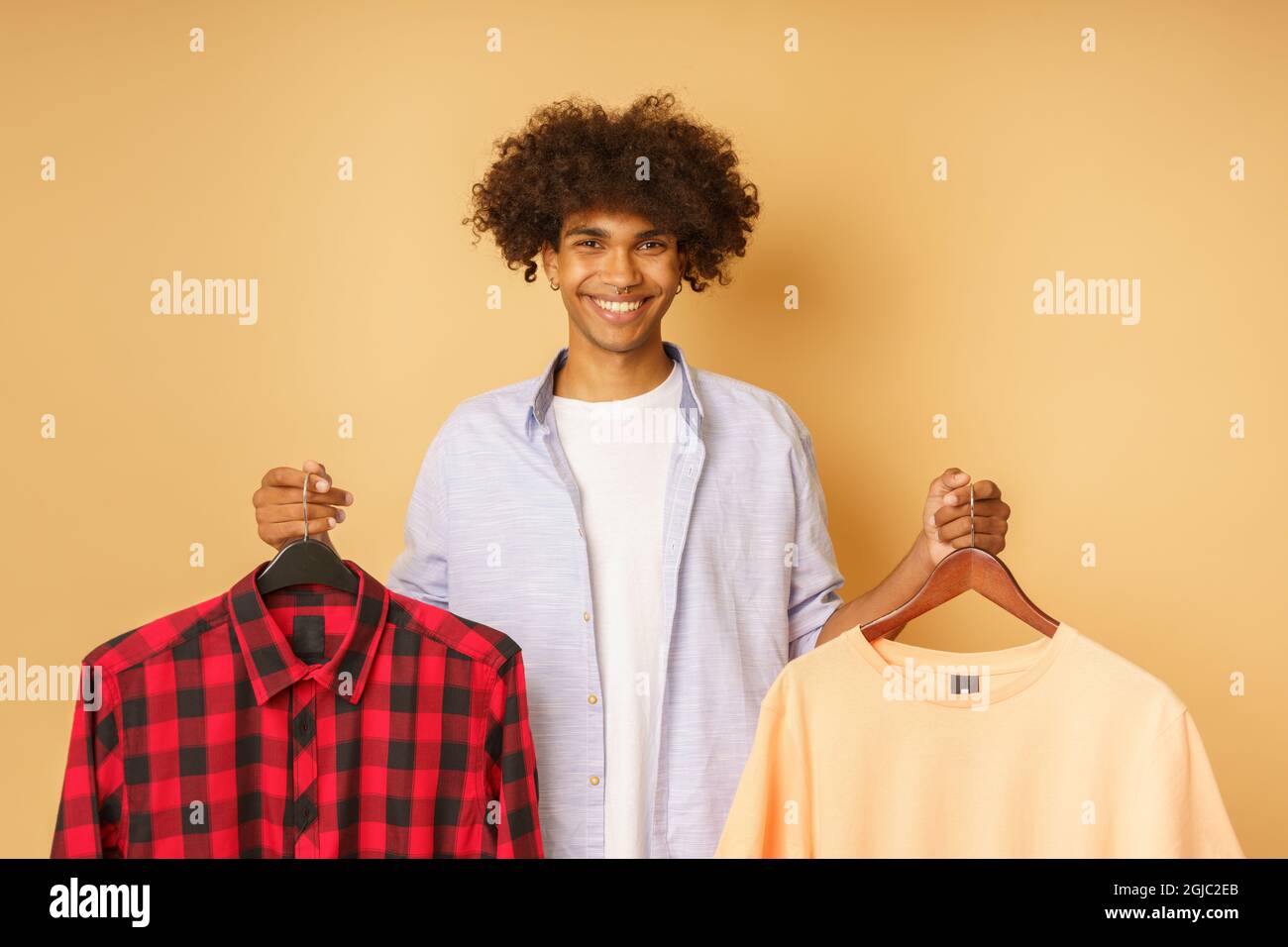 Happy happy man buy clothes on a store Stock Photo - Alamy