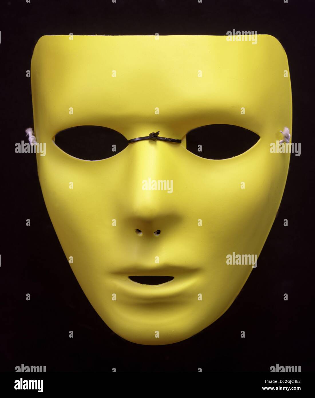 Blank Face Yellow Half Mask Isolated Against Black Background Stock ...