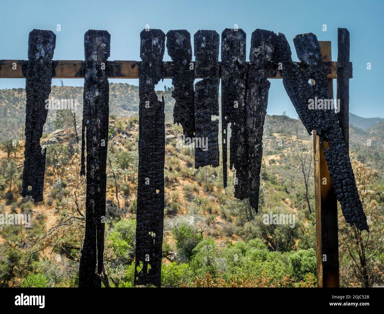 Fence showing effects of wildfire in Southern Sierra Nevada Mountains ...