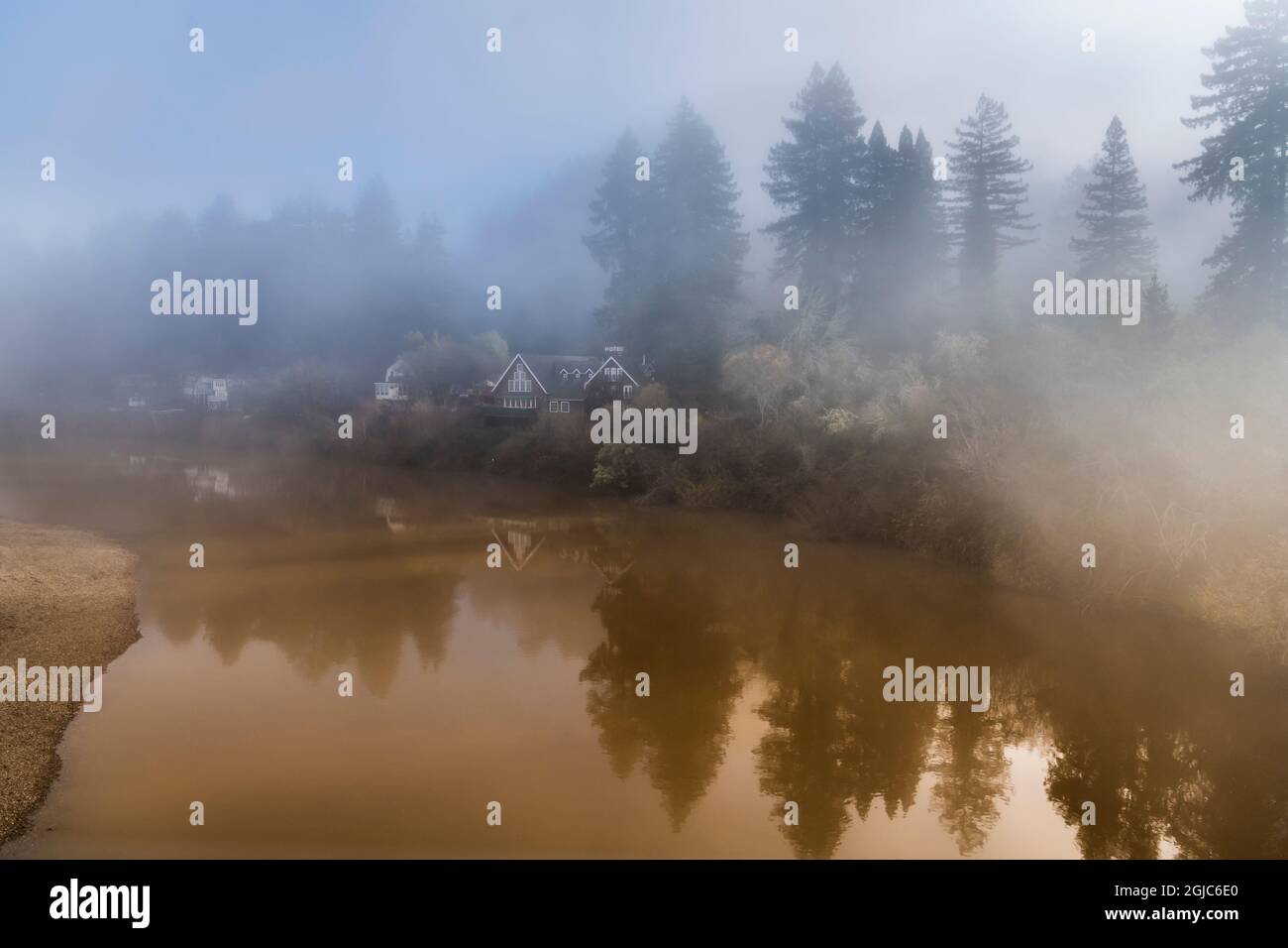 The fog clearing from the Russian River as the sun rises Stock Photo ...