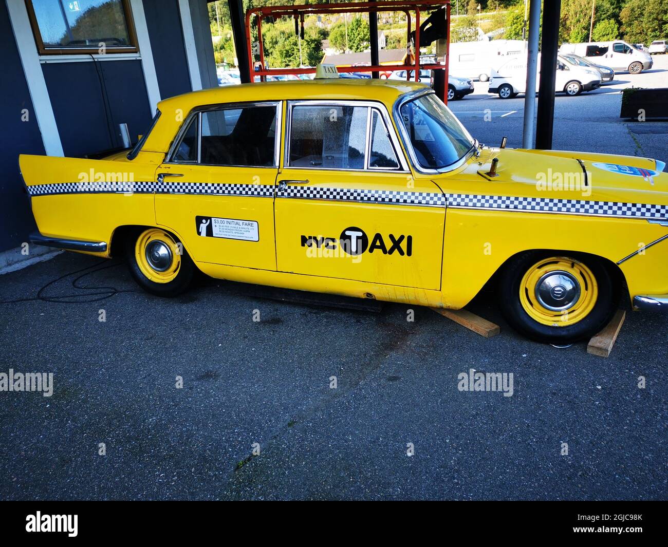 Traditional yellow taxi cab in the parking area Stock Photo - Alamy