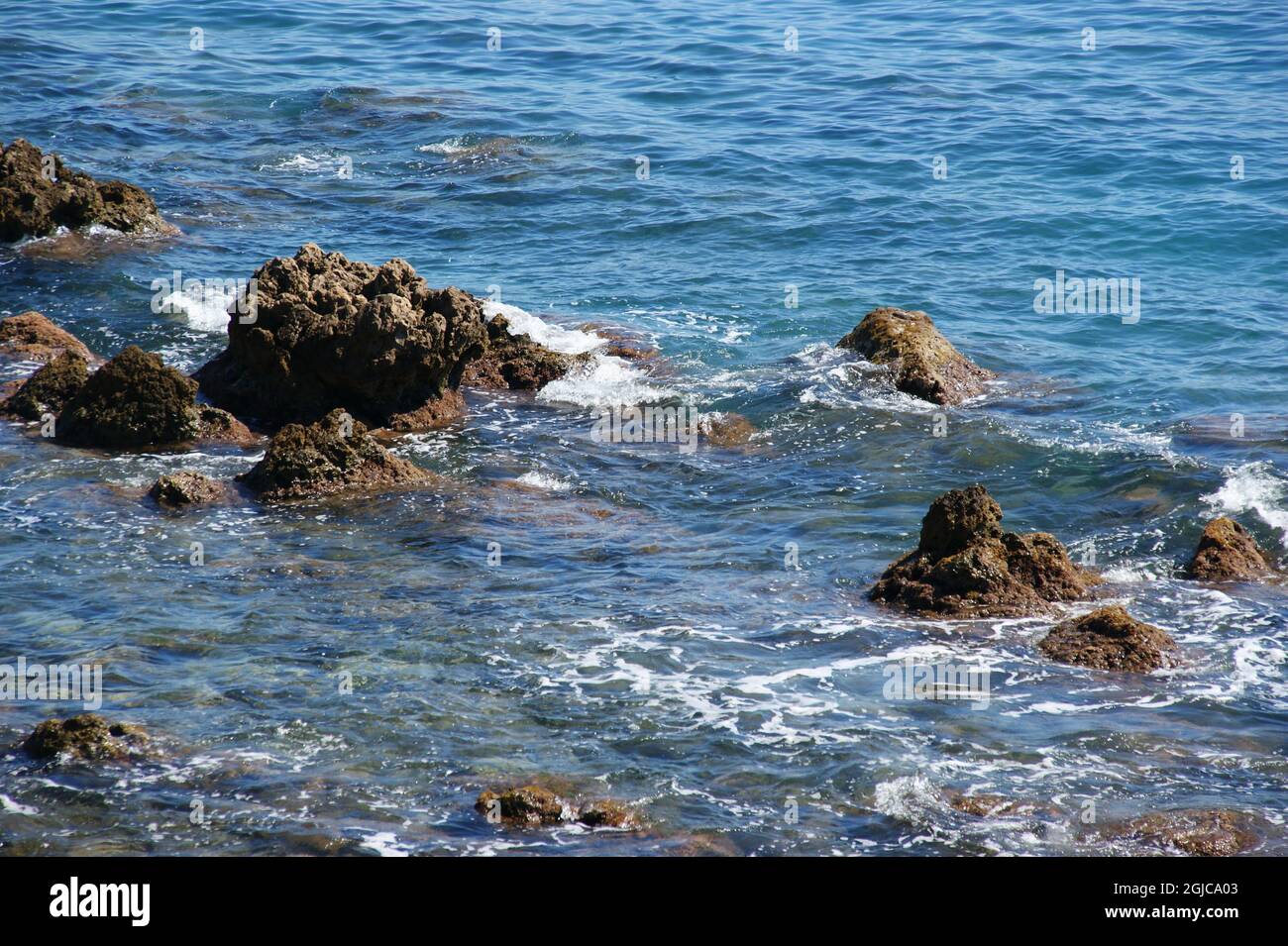 ANTIBES, FRANCE - Aug 12, 2011: A natural view of the rocky coast of ...