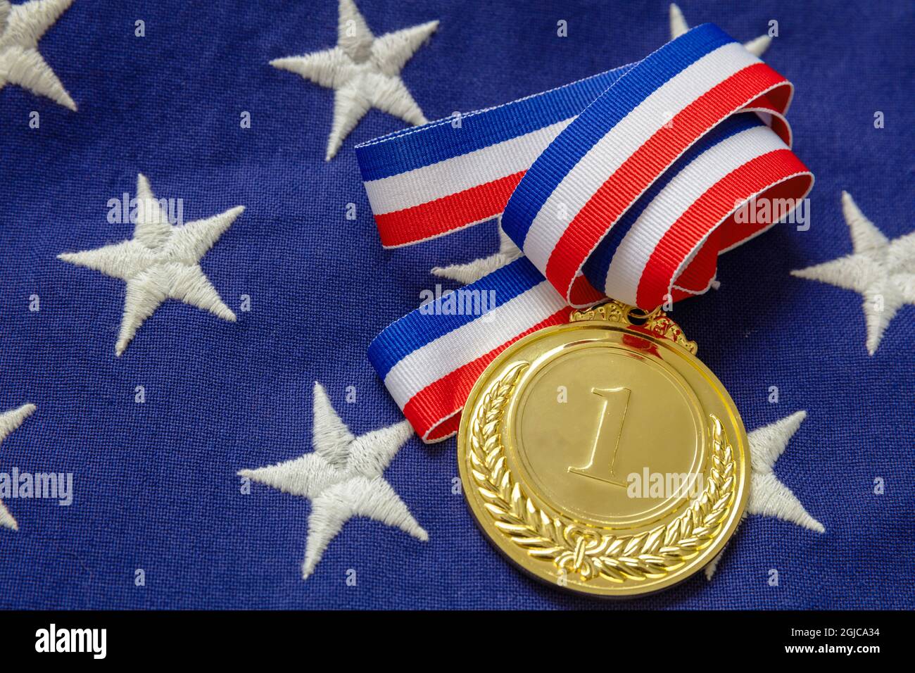 Medal gold for USA. Winner prize award with ribbon on US flag ...