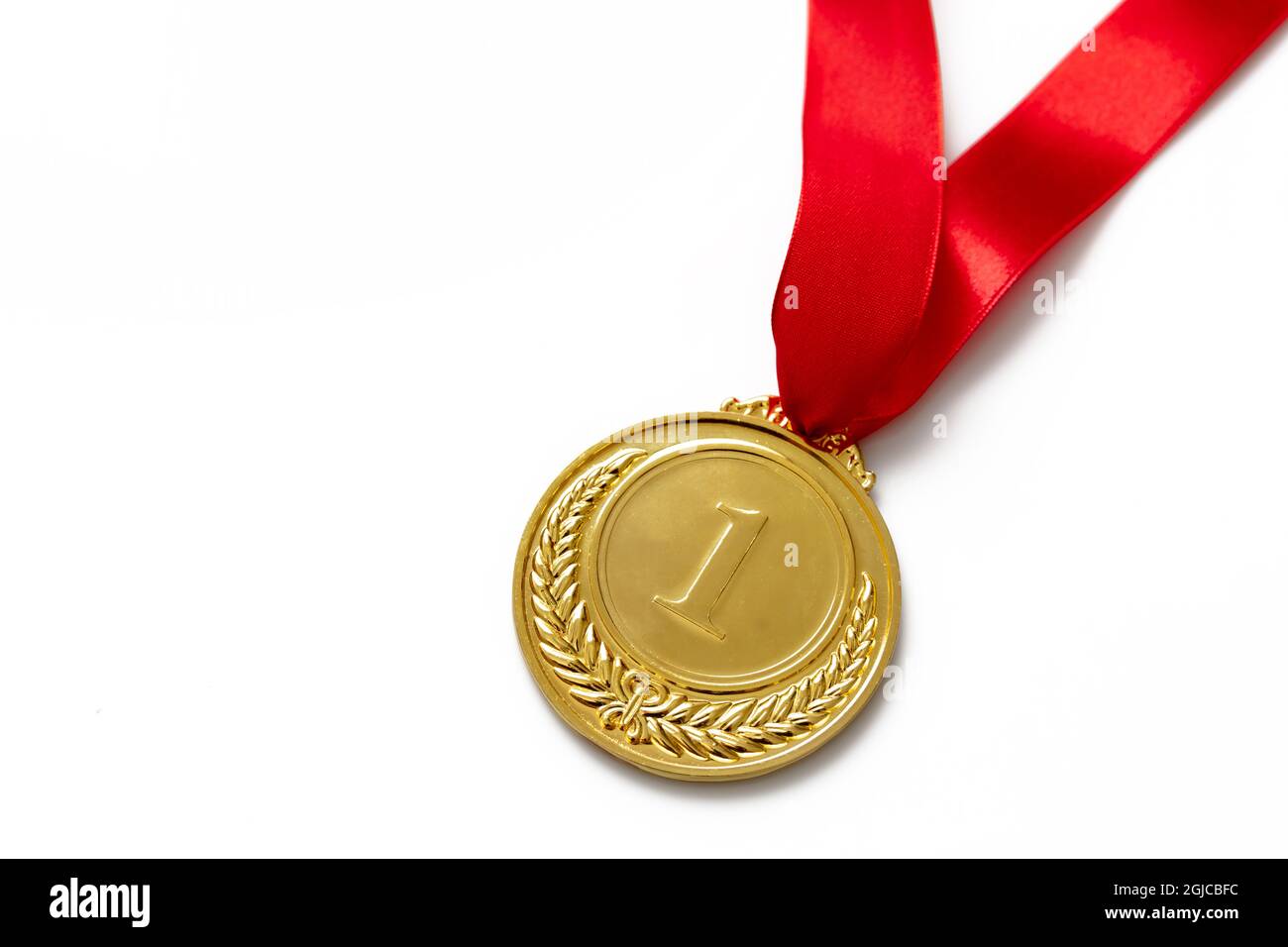 Gold medal, number one laurel wreath and red color ribbon isolated on ...