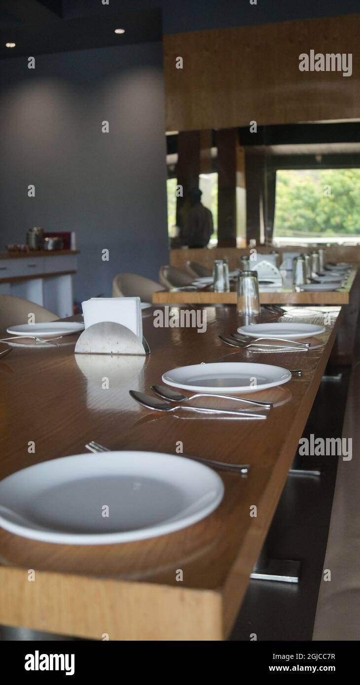 Dining set up with utensils on the table Stock Photo - Alamy