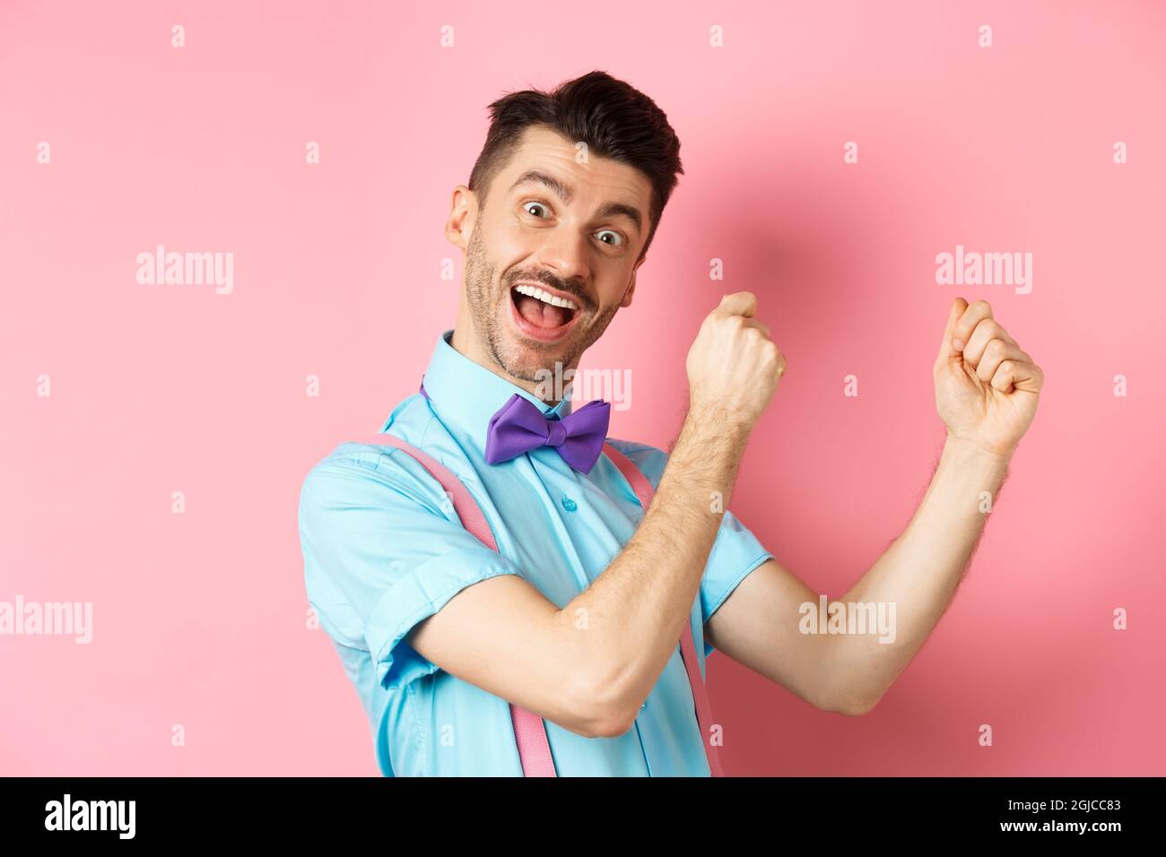 Image of cheerful man celebrating holiday, dancing and having fun ...