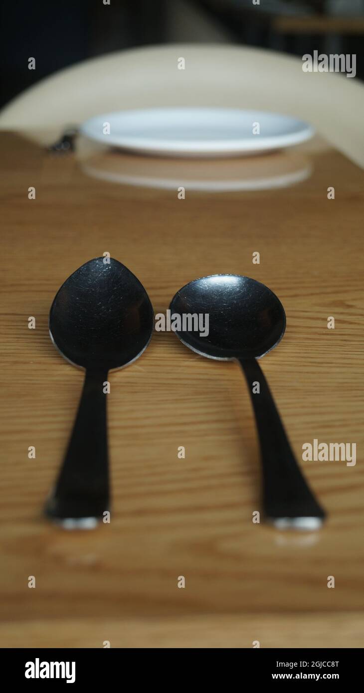 Dining set up with utensils on the table Stock Photo - Alamy