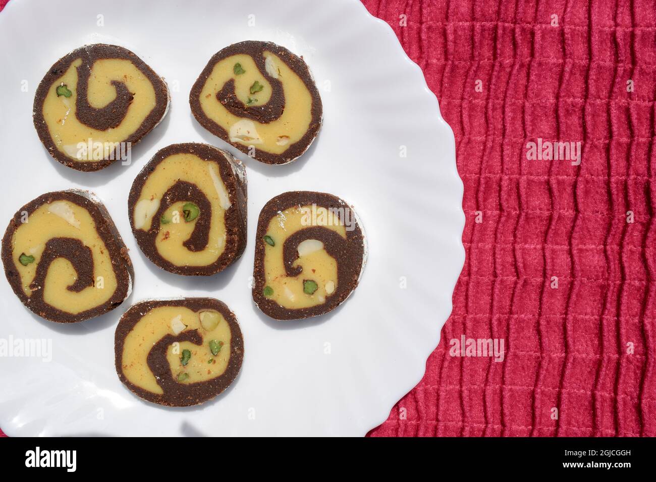 Indian sweet dish called Chocolate barfi roll. Burfi is milk based ...