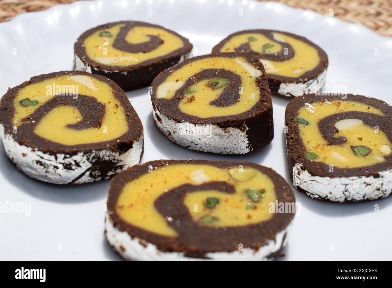 Indian sweet dish called Chocolate barfi roll. Burfi is milk based ...