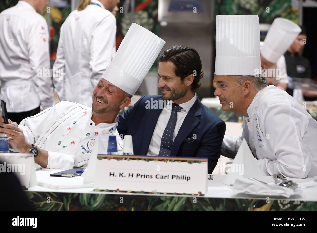 Jury member Stefano Catenacci takes a photo with his mobile phone of ...