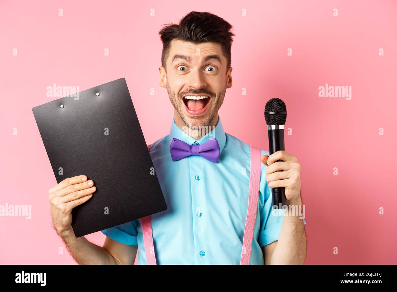 Holidays concept. Happy young man entertainer smiling at camera ...