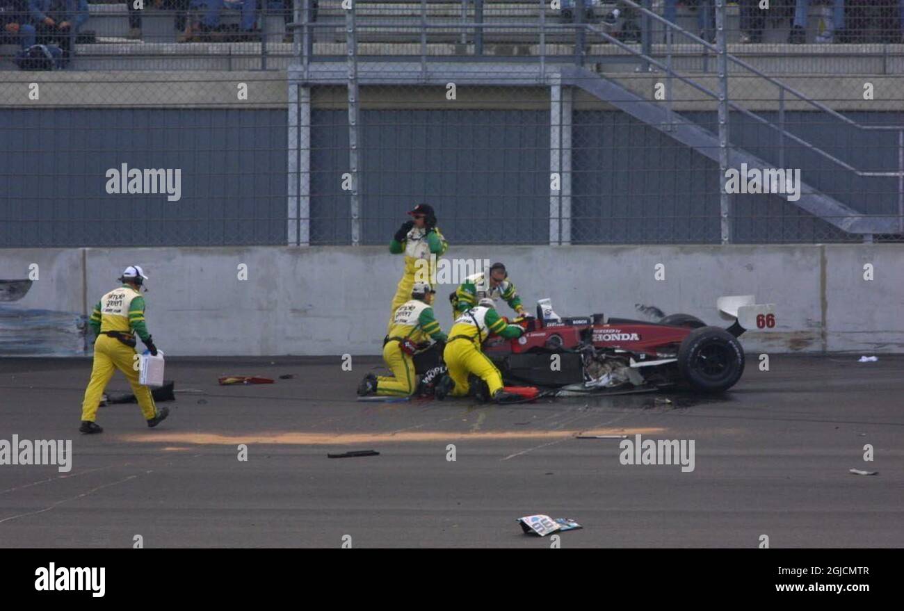 Alex Zanardi is attended to by Marshalls after he was hit by Alex ...