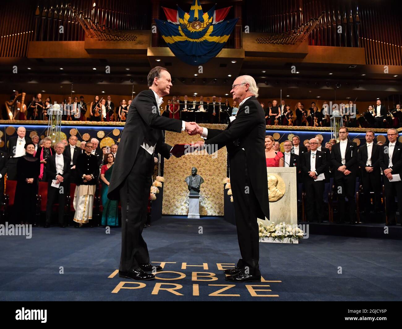 Physiology or Medicine laureate William G. Kaelin Jr, left, receives ...