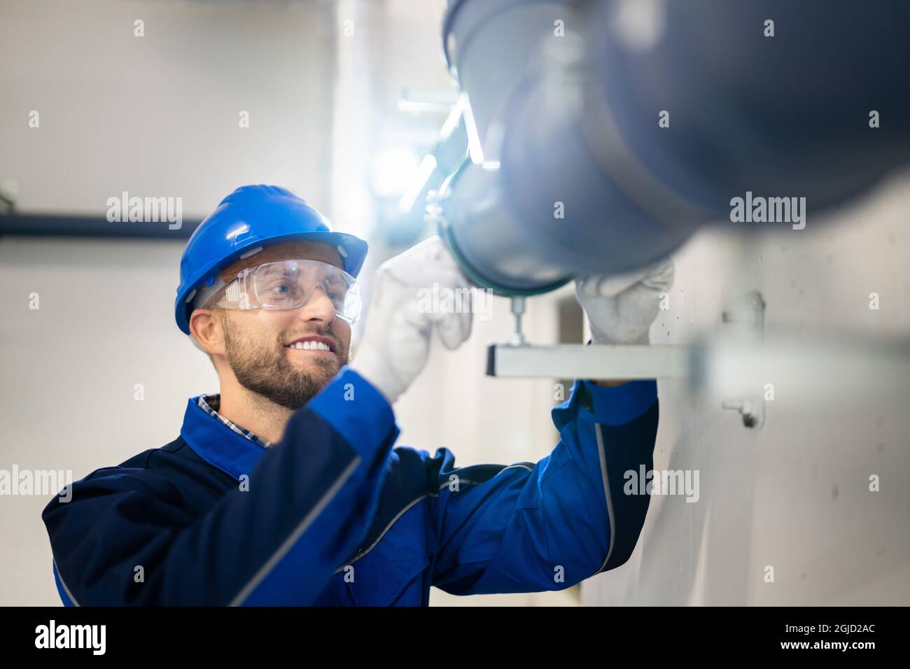 PVC Water Pipe Inspection By Construction Worker Stock Photo - Alamy