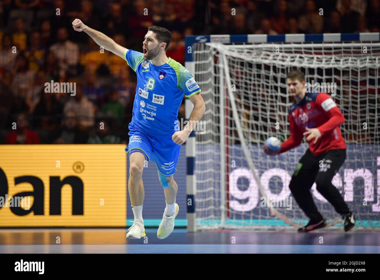 Slovenia's Blaz Janc (L) celebrates scoring during the bronze medal ...