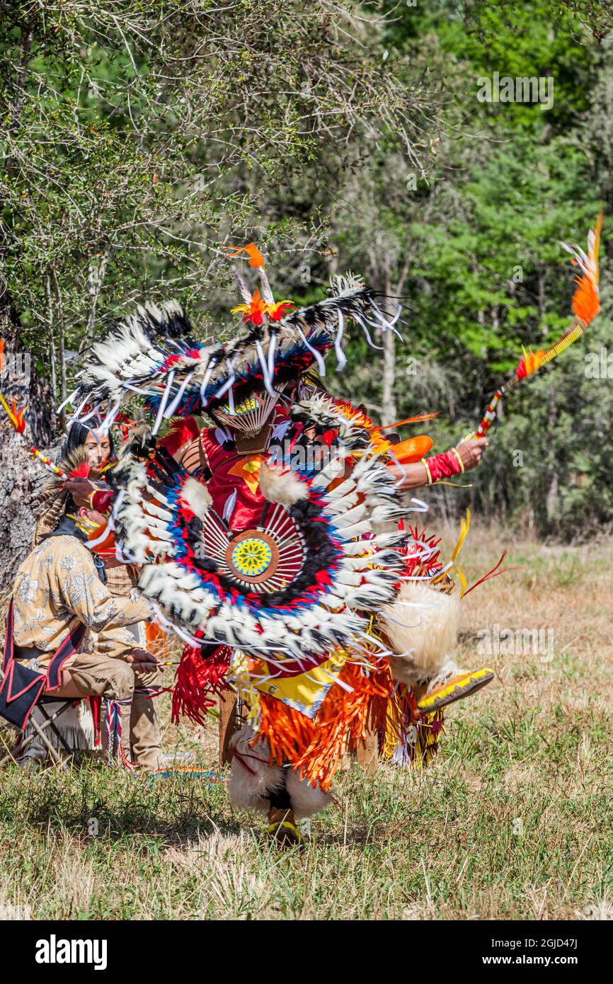 Bright colors and feathers define this Native American ceremonial dance ...