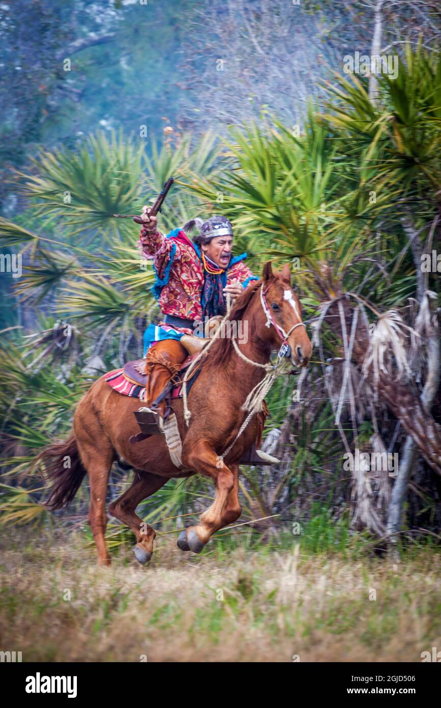 Seminole War reenactment, Seminole actors ride through the scene ...