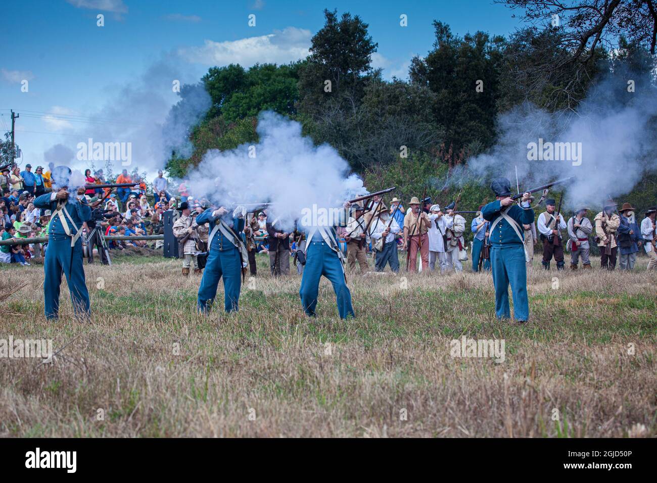 Musket smoke erupts from barrels at a Seminole War reenactment ...