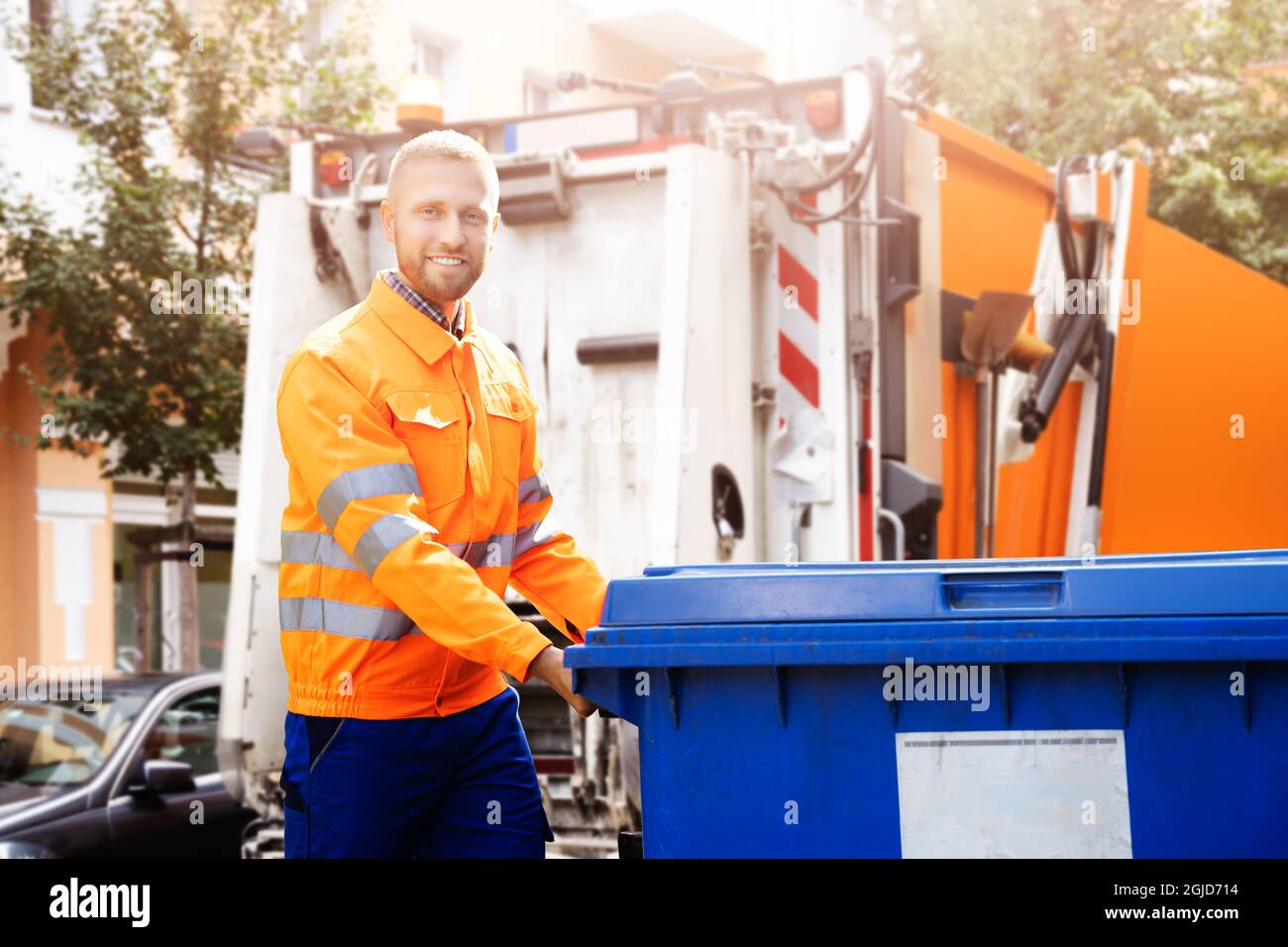 Garbage Removal Man Doing Trash And Rubbish Collection Stock Photo - Alamy