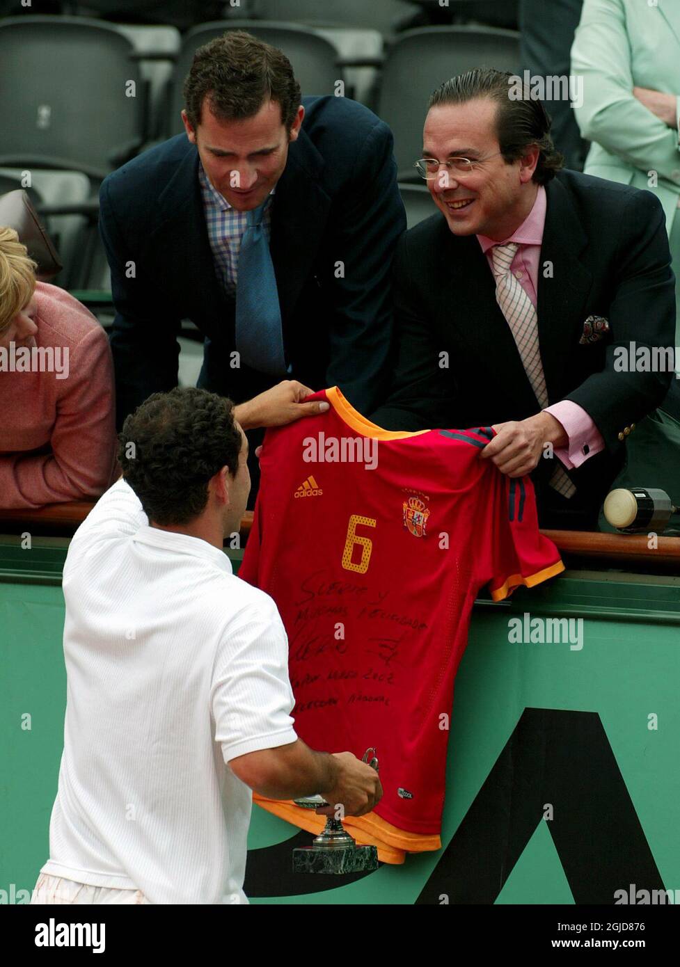 Crown Prince Felipe of Spain gives Albert Costa a Spanish football ...