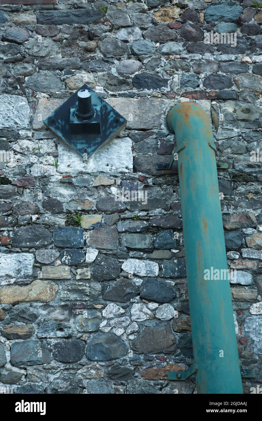 USA, Georgia, Savannah. Stone wall with earthquake bar along River ...