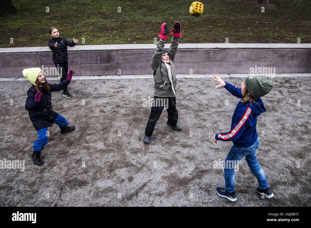 School children exercising outdoors in Stockholm, Sweden, March 23, 2020, during the coronavirus ...