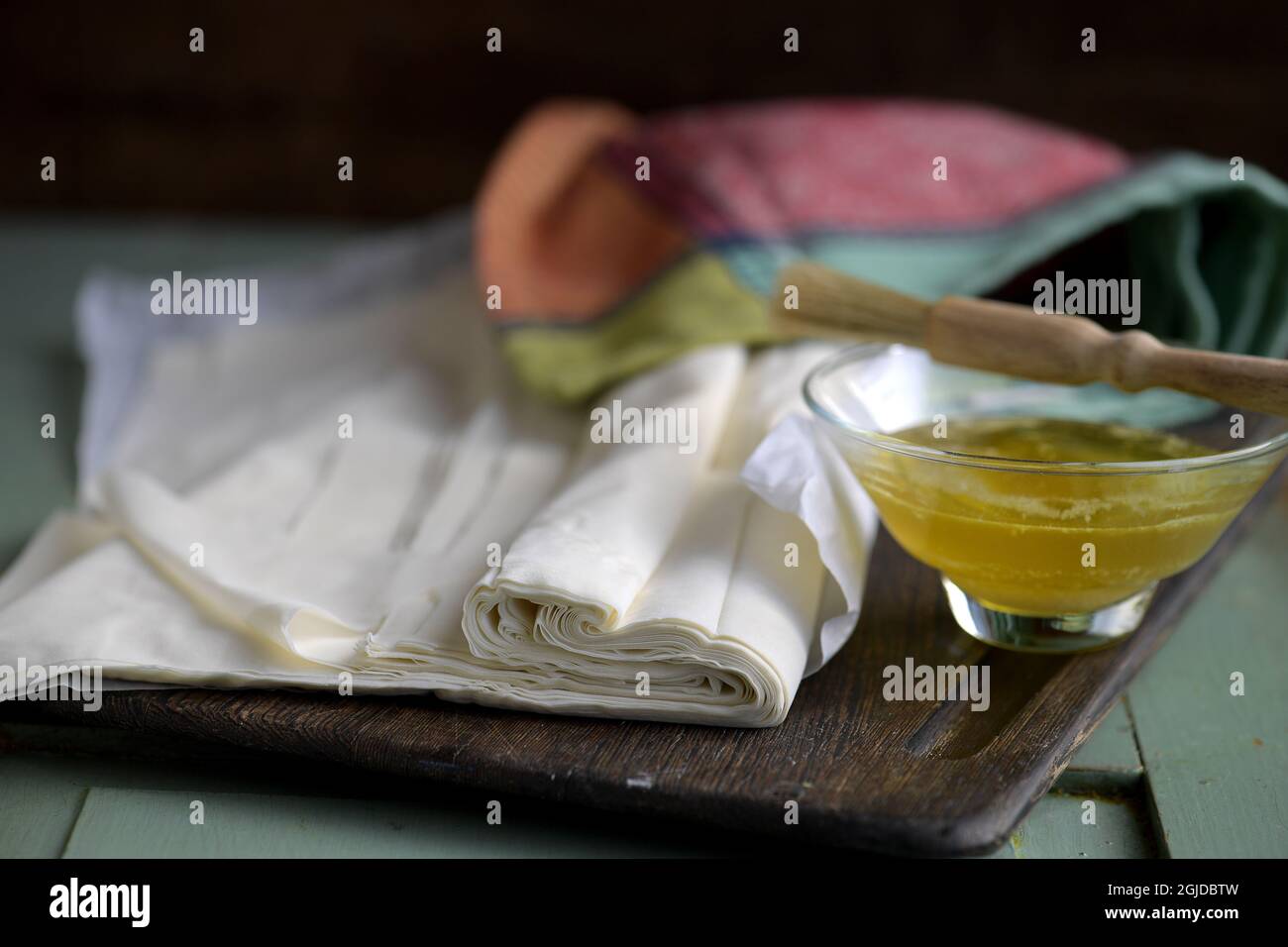 Making phyllo / filo pastries and pies. Sheets of filo pastry, oil and ...