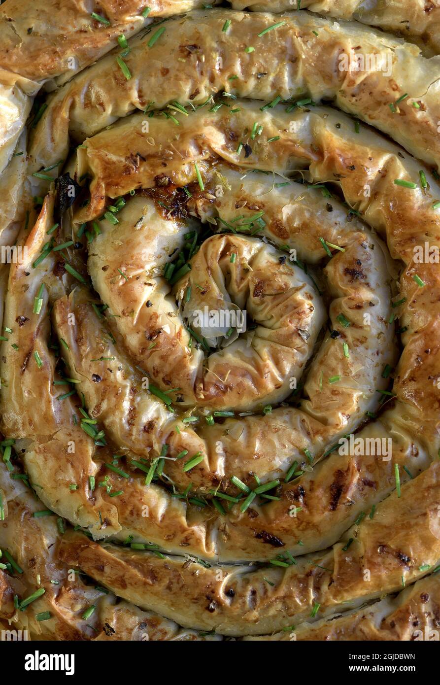 Making phyllo / filo pastries and pies. Borek with a pumpkin, spinach ...