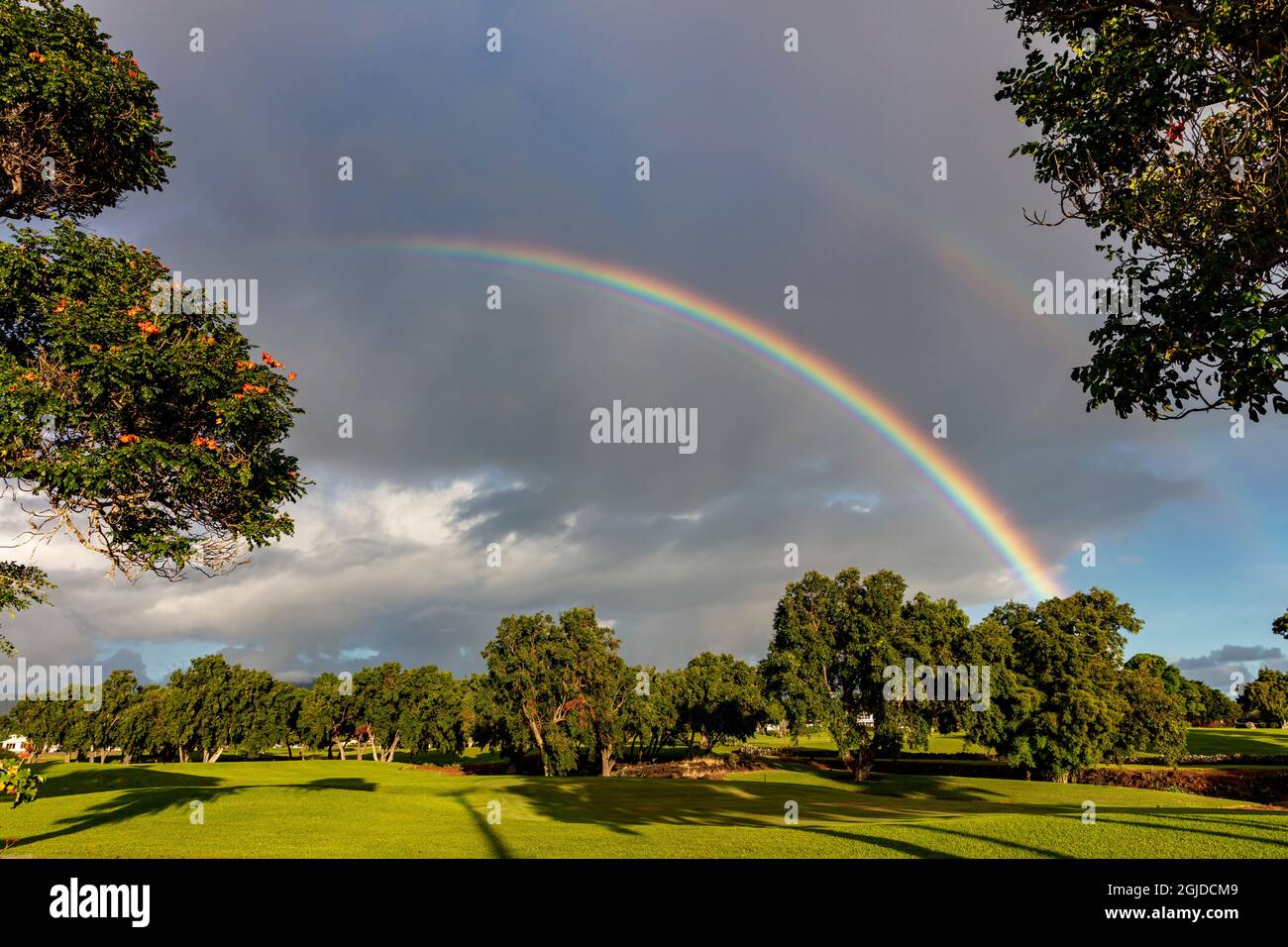 Rainbow over golf course in Koloa in Kauai, Hawaii, USA Stock Photo - Alamy