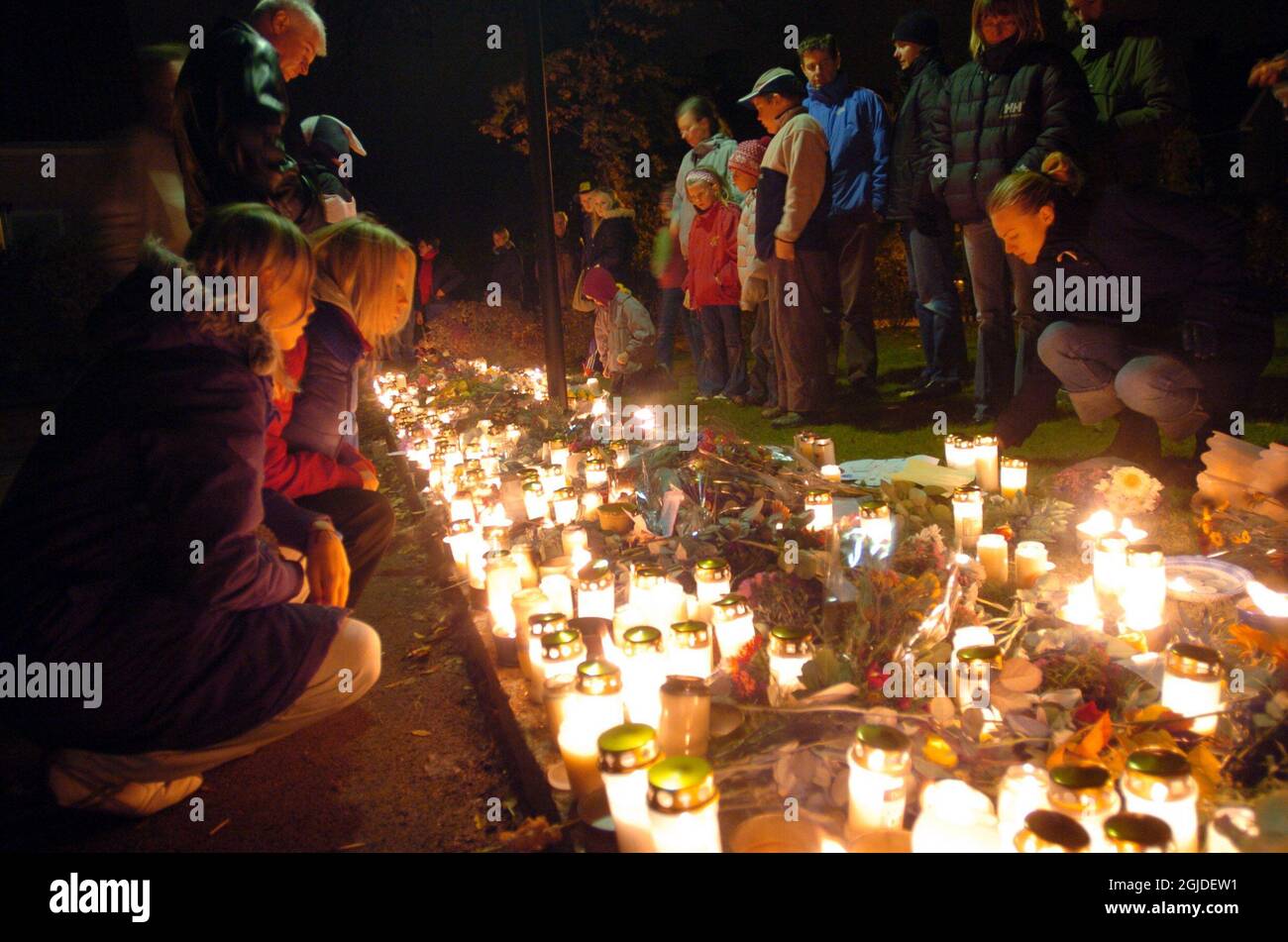 A candlelight vigil at the scene of the double murder in the city of ...