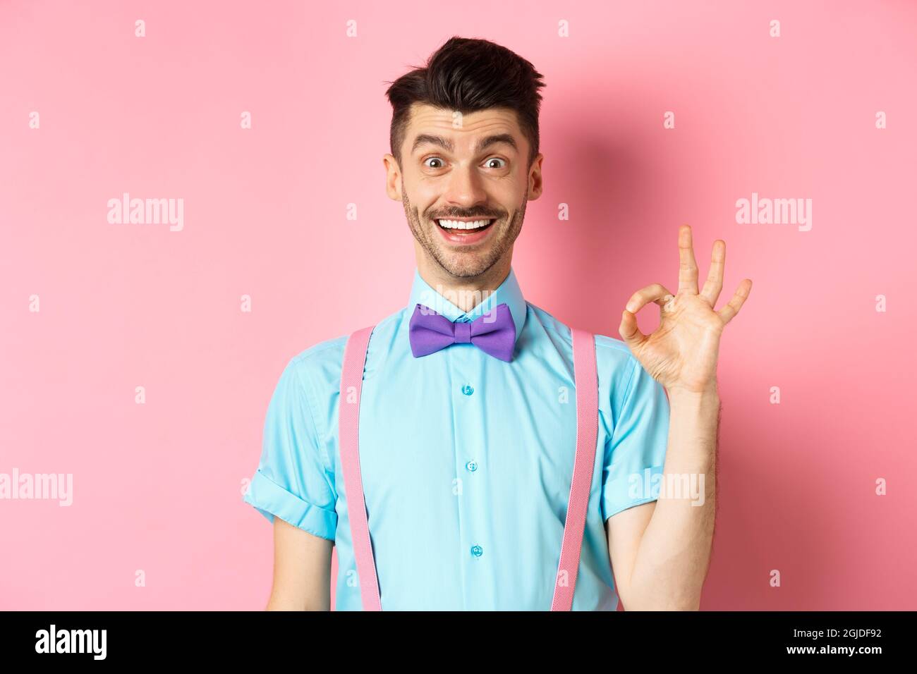 Handsome caucasian man with moustache smiling and showing okay sign ...